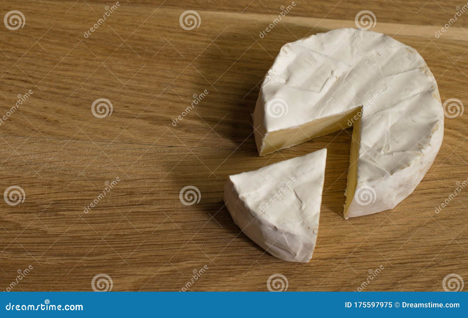 Fresh Brie Cheese with White Mold on a White Background on Table Stock ...