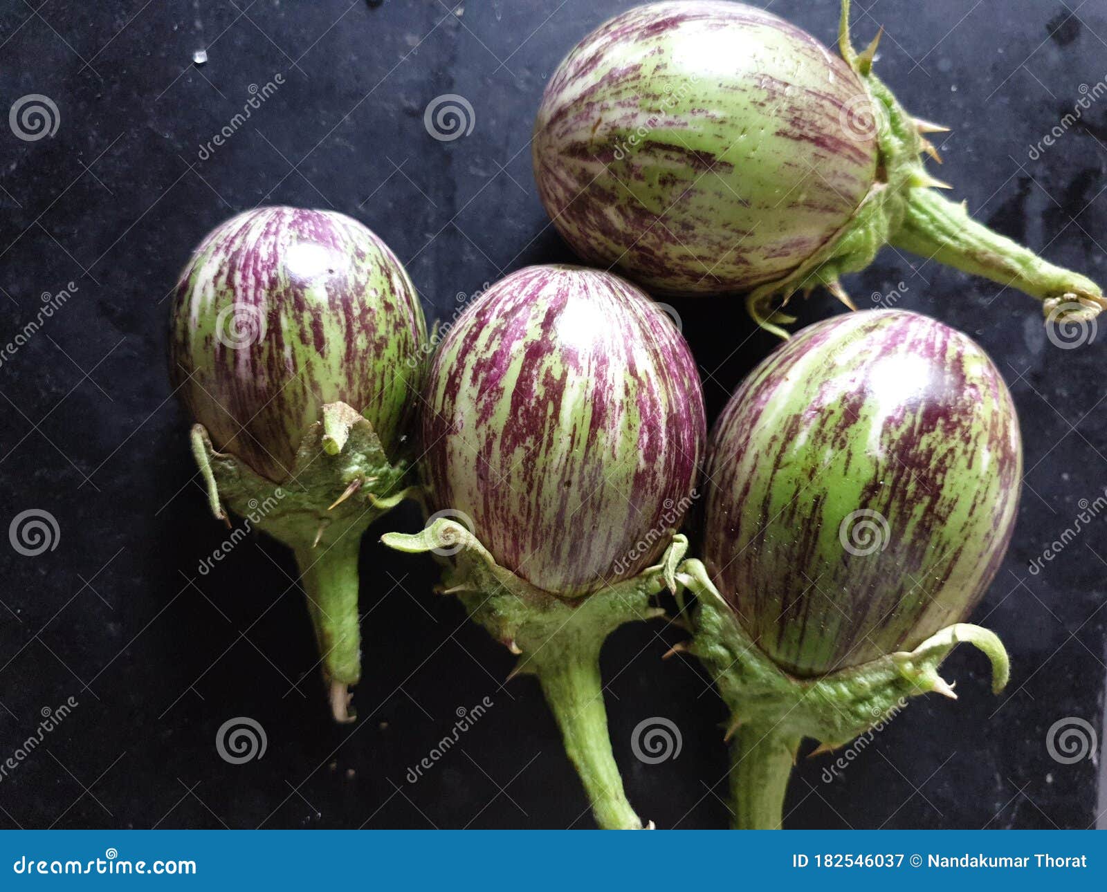 Fresh Brinjal Vegetable On Chopping Board Royalty-Free Stock ...