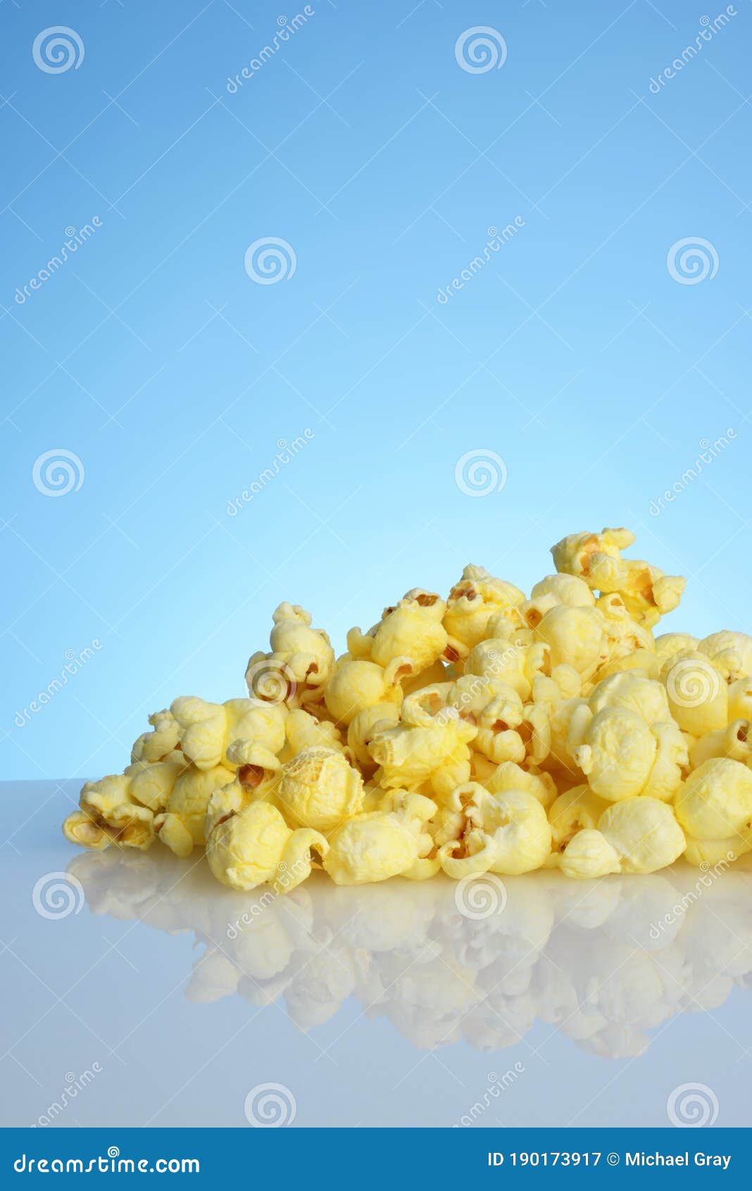 Air Popcorn On A Blue Background With Three Grains In The Form Of A ...
