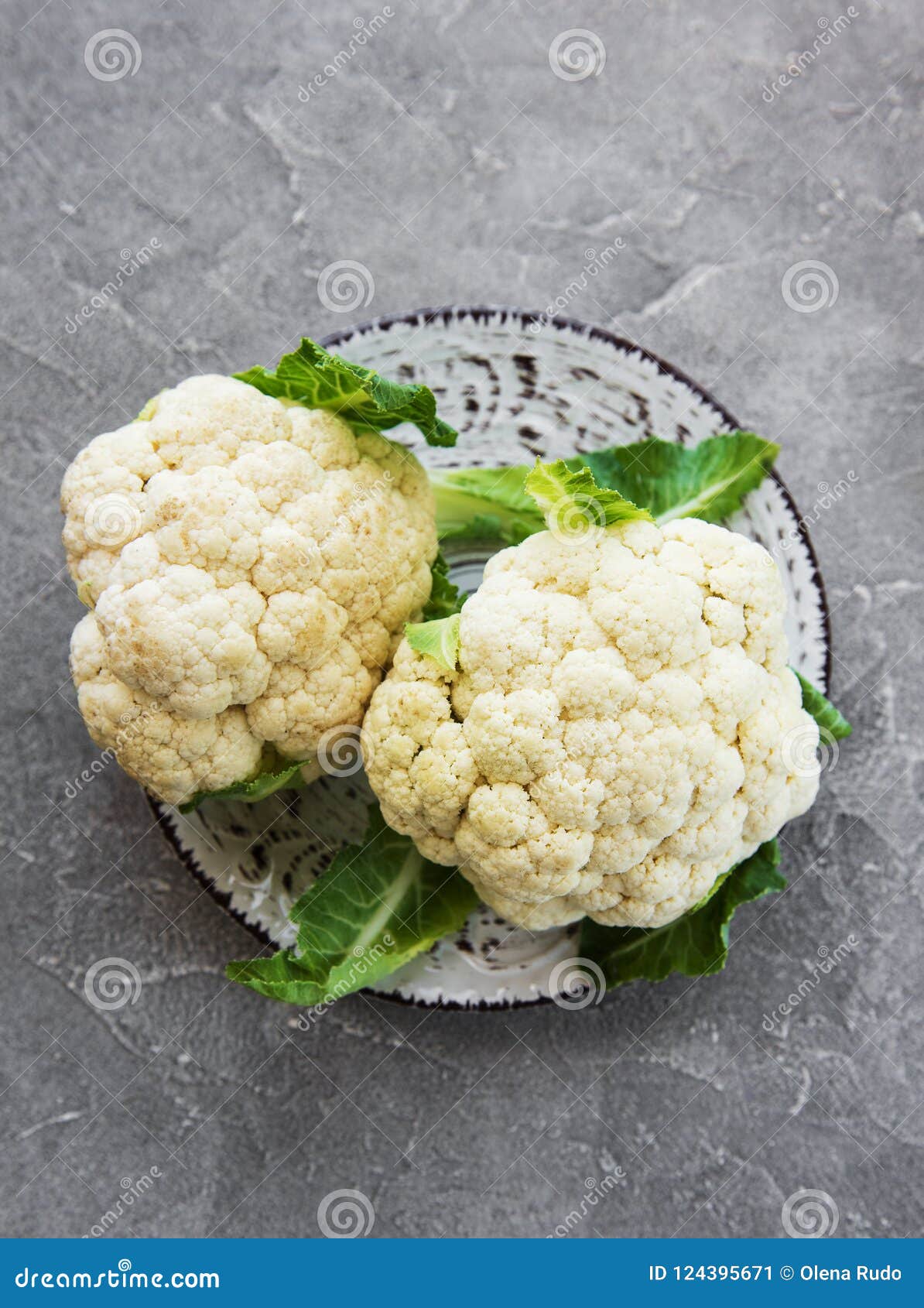 Fresh cauliflower on plate stock image. Image of product - 124395671