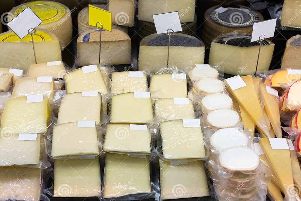 Fresh Cheese in Packs and in Bulk on Counter Stock Image - Image of ...