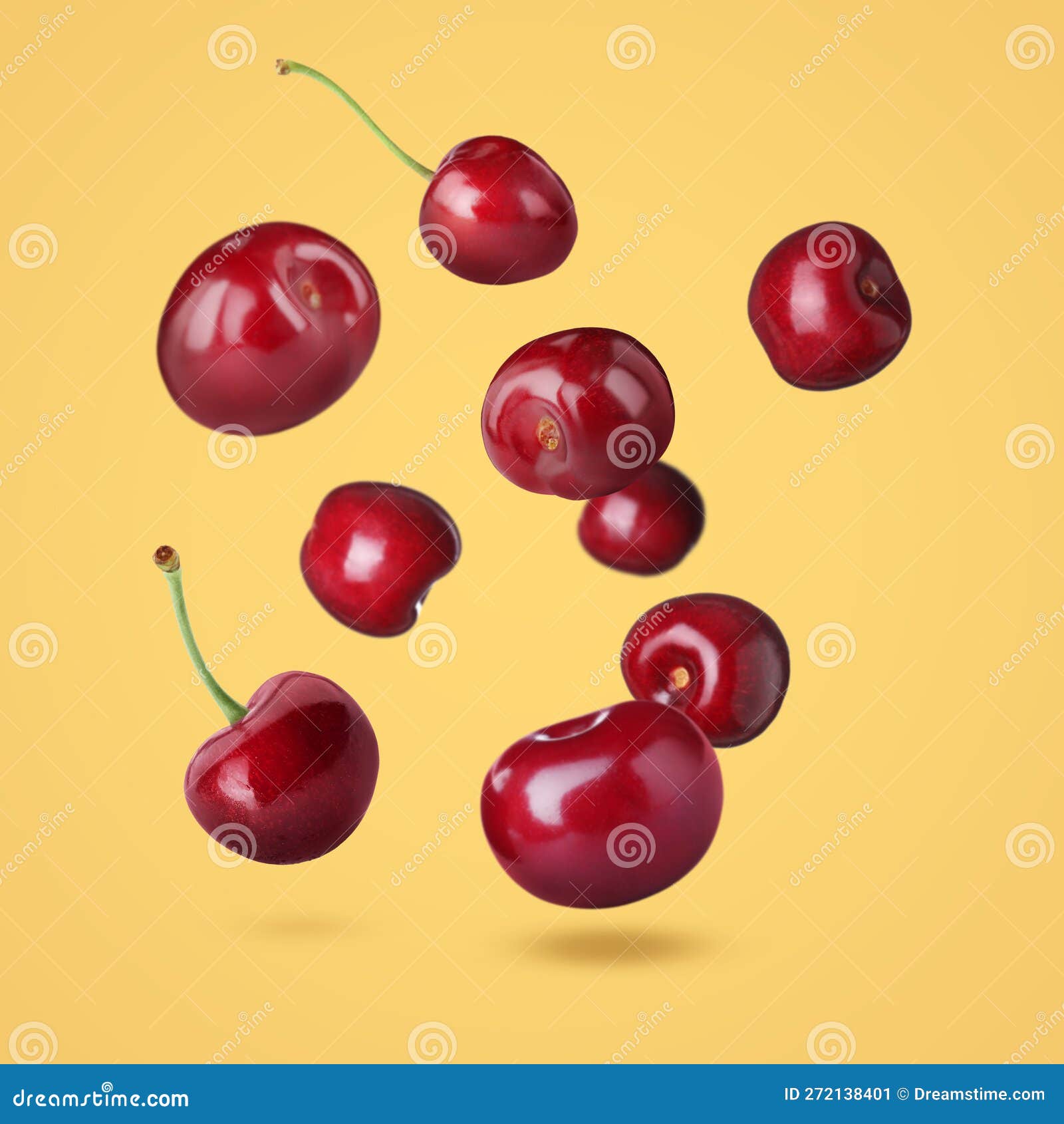 Fresh Cherries Falling on Pale Orange Background Stock Image - Image of ...