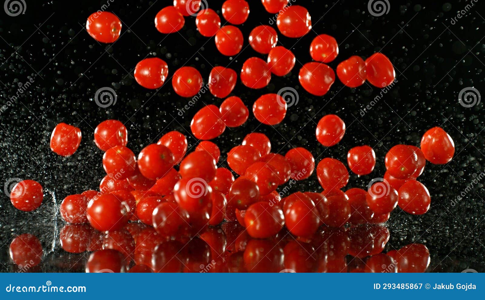 Fresh Cherry Tomatoes Falling Down on Black Background Stock Image ...