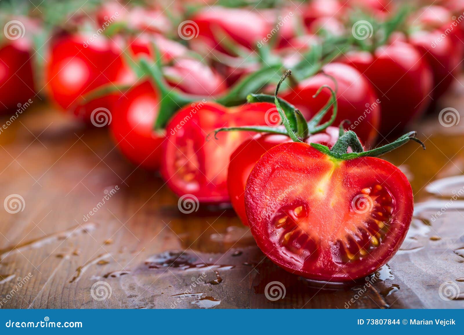 Fresh Cherry Tomatoes Washed Clean Water. Cut Fresh Tomatoes Stock ...
