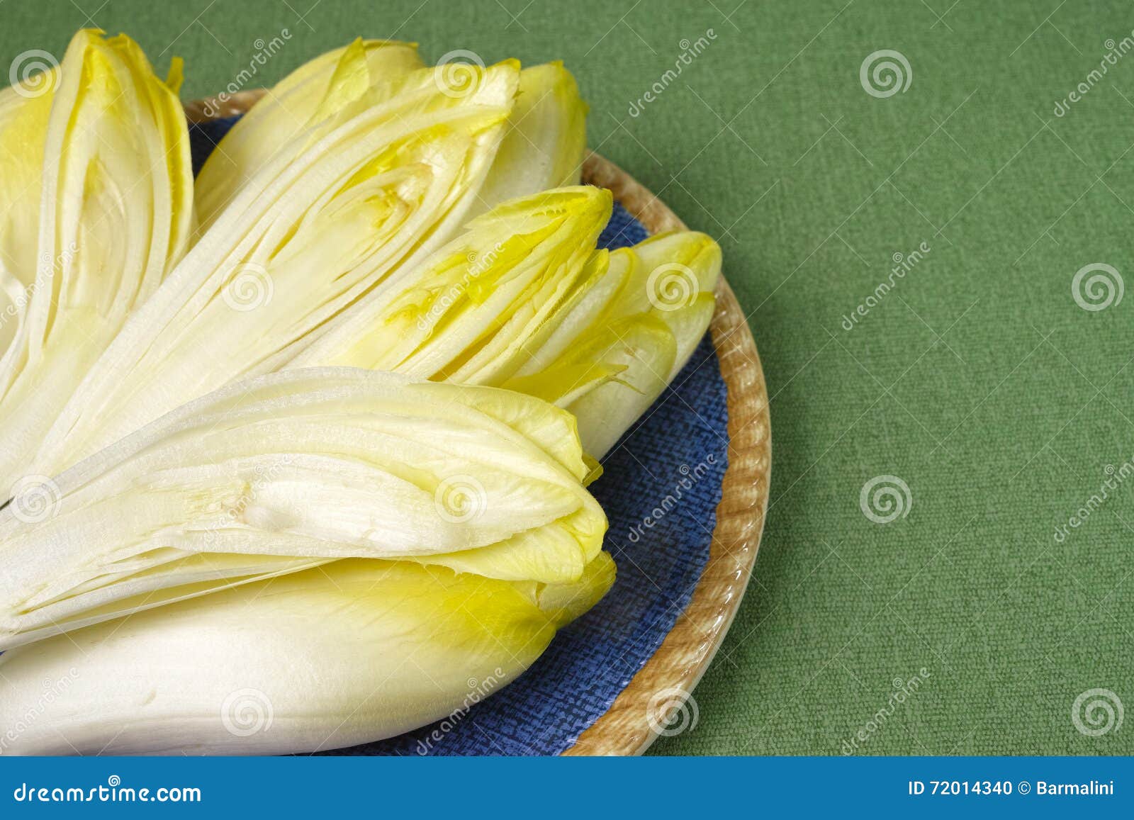 Fresh Chicory Salad Leaves Placed on a Blue Plate Stock Photo - Image ...