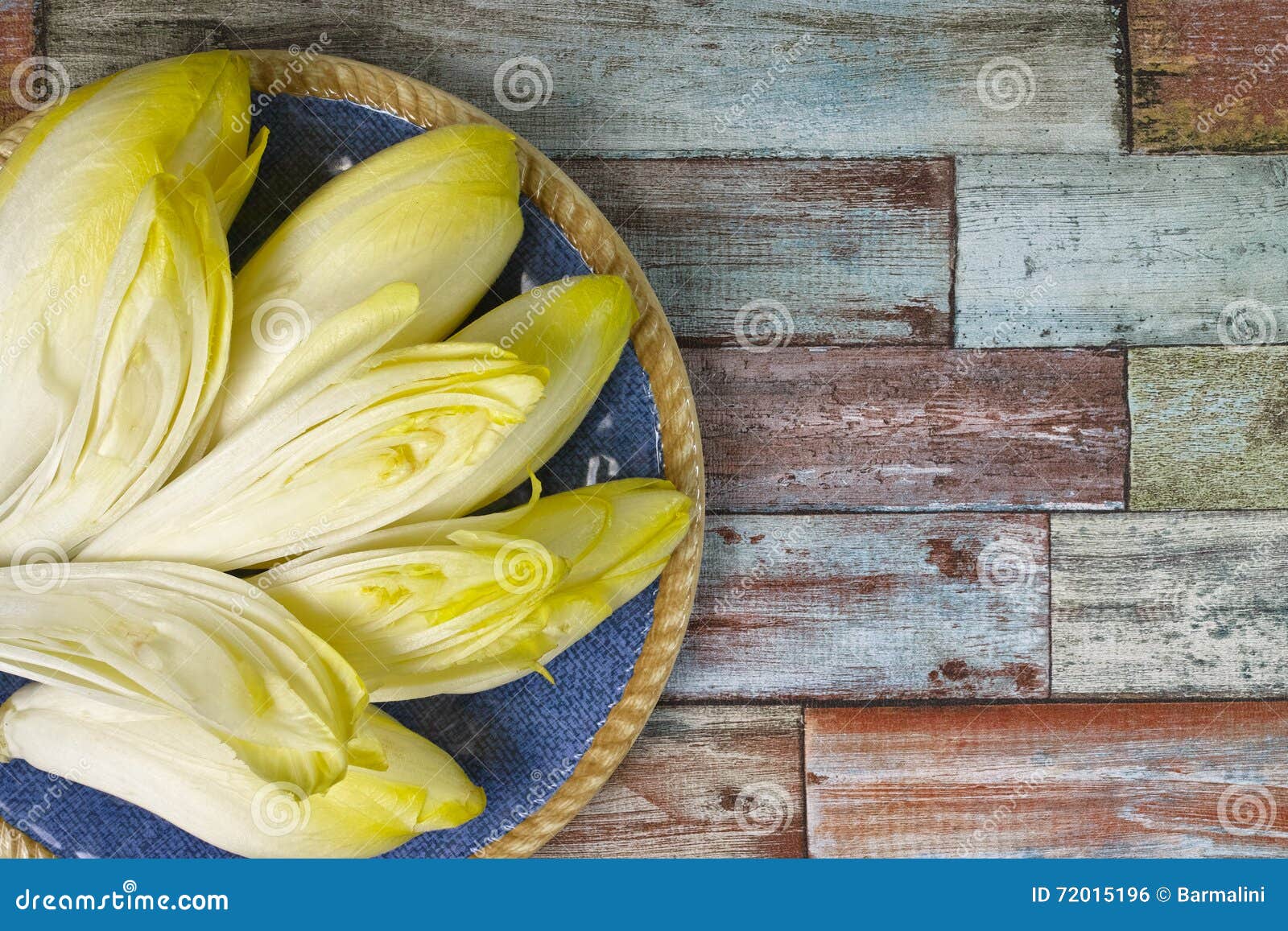 Fresh Chicory Salad Leaves Placed on a Blue Plate Stock Photo - Image ...