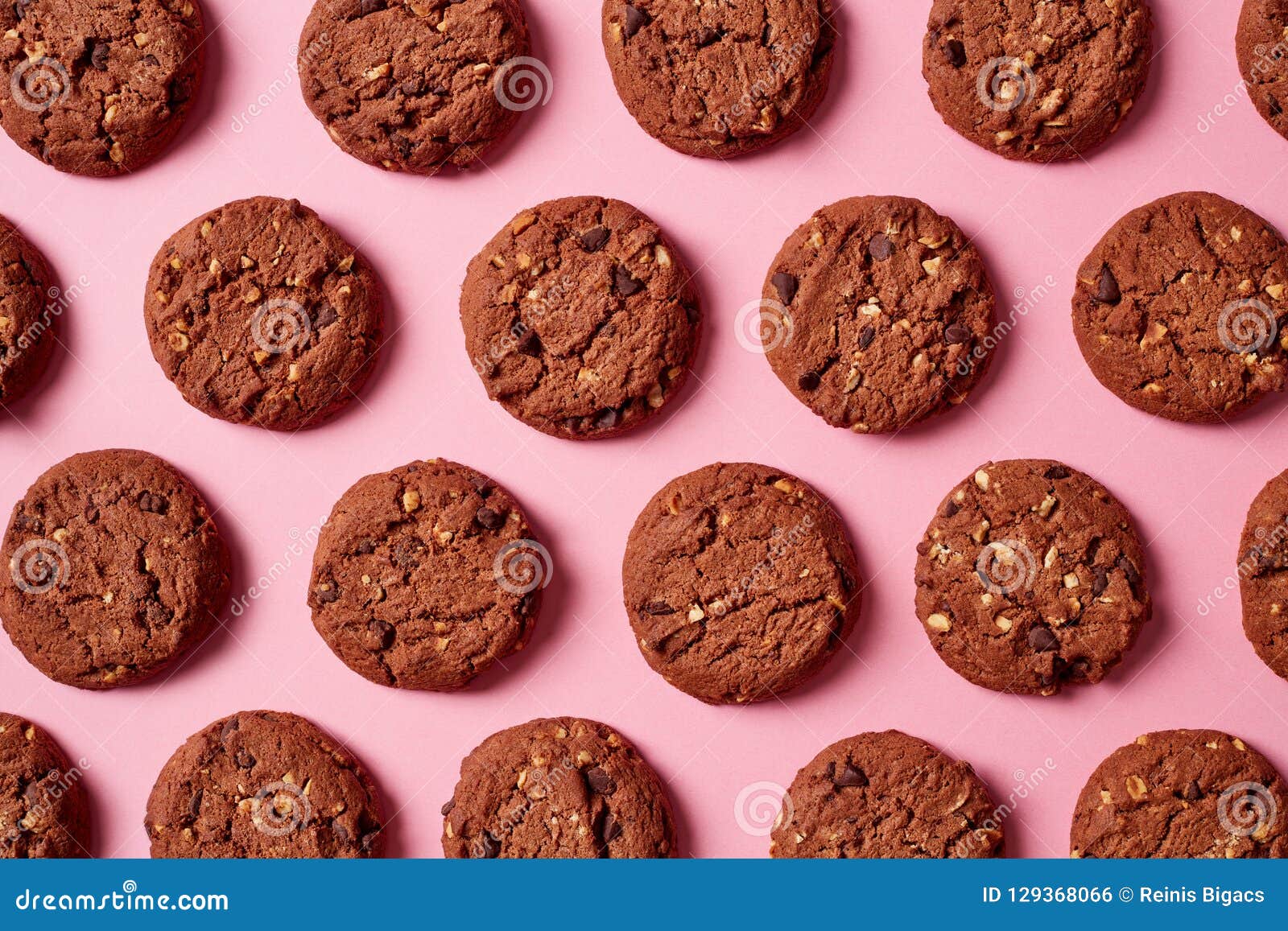 Fresh Chocolate Chip Cookies Pattern on Pink Background Stock Photo ...
