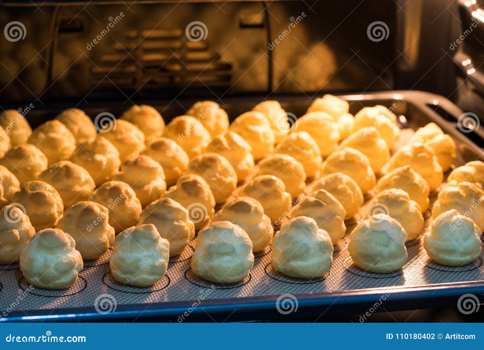 Fresh Choux Cream or Eclair in Hot Oven. Stock Photo - Image of ...