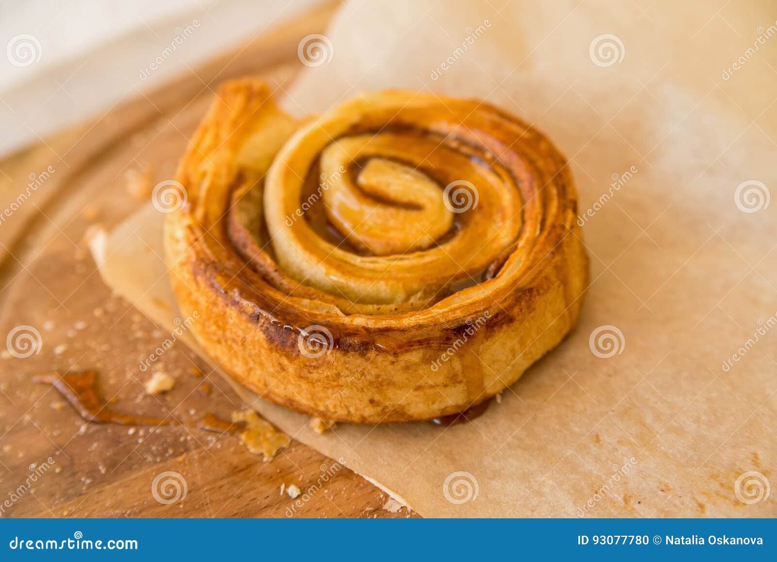 Fresh Cinnamon Roll on Paper Stock Photo - Image of dough, paper: 93077780