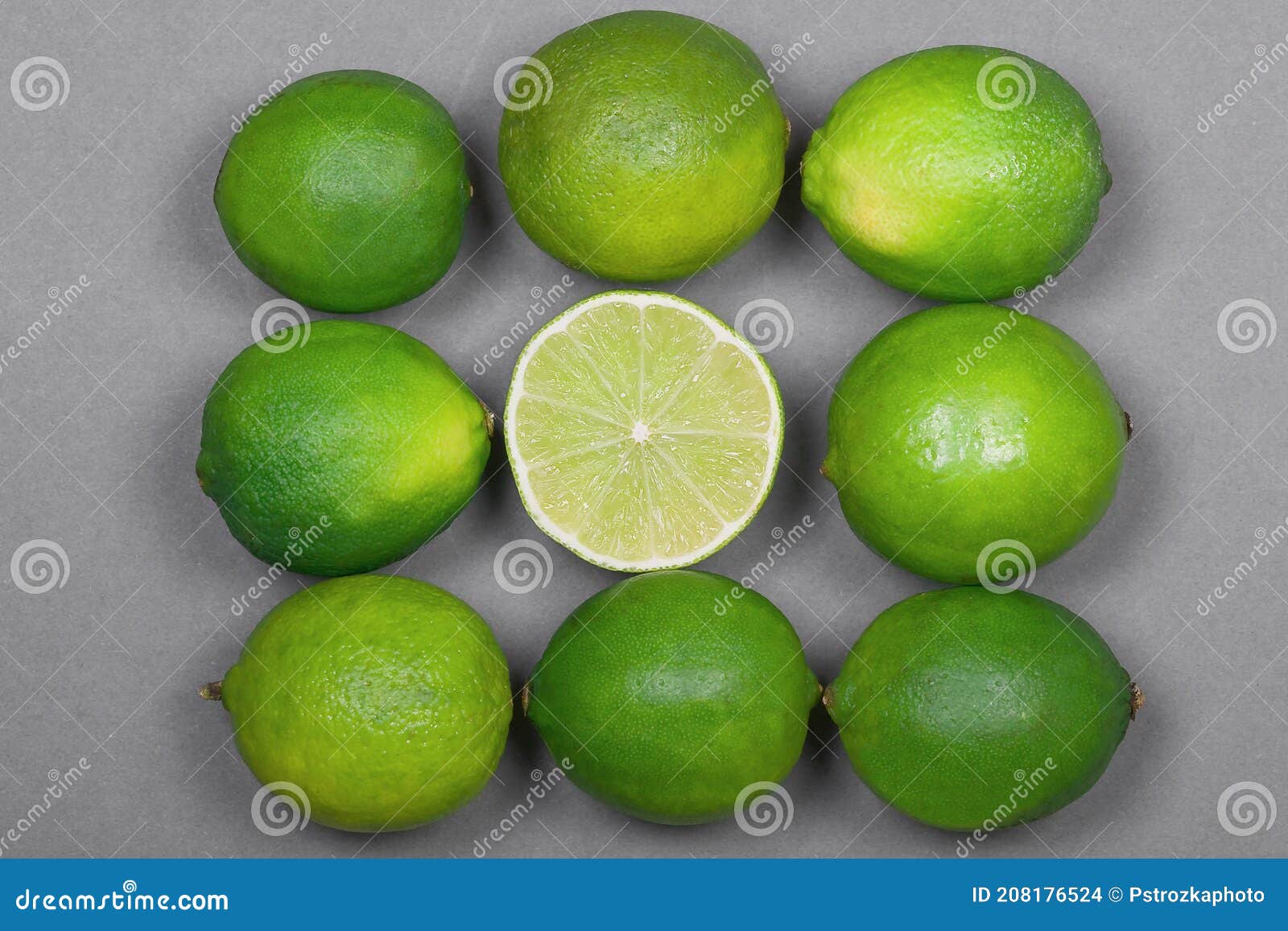 Fresh Citrus Limes and One Half Inside Stock Photo - Image of black ...