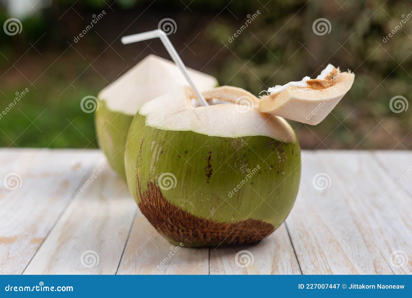 Fresh Coconut Ready To Drink on the Wooden Table Stock Image - Image of ...