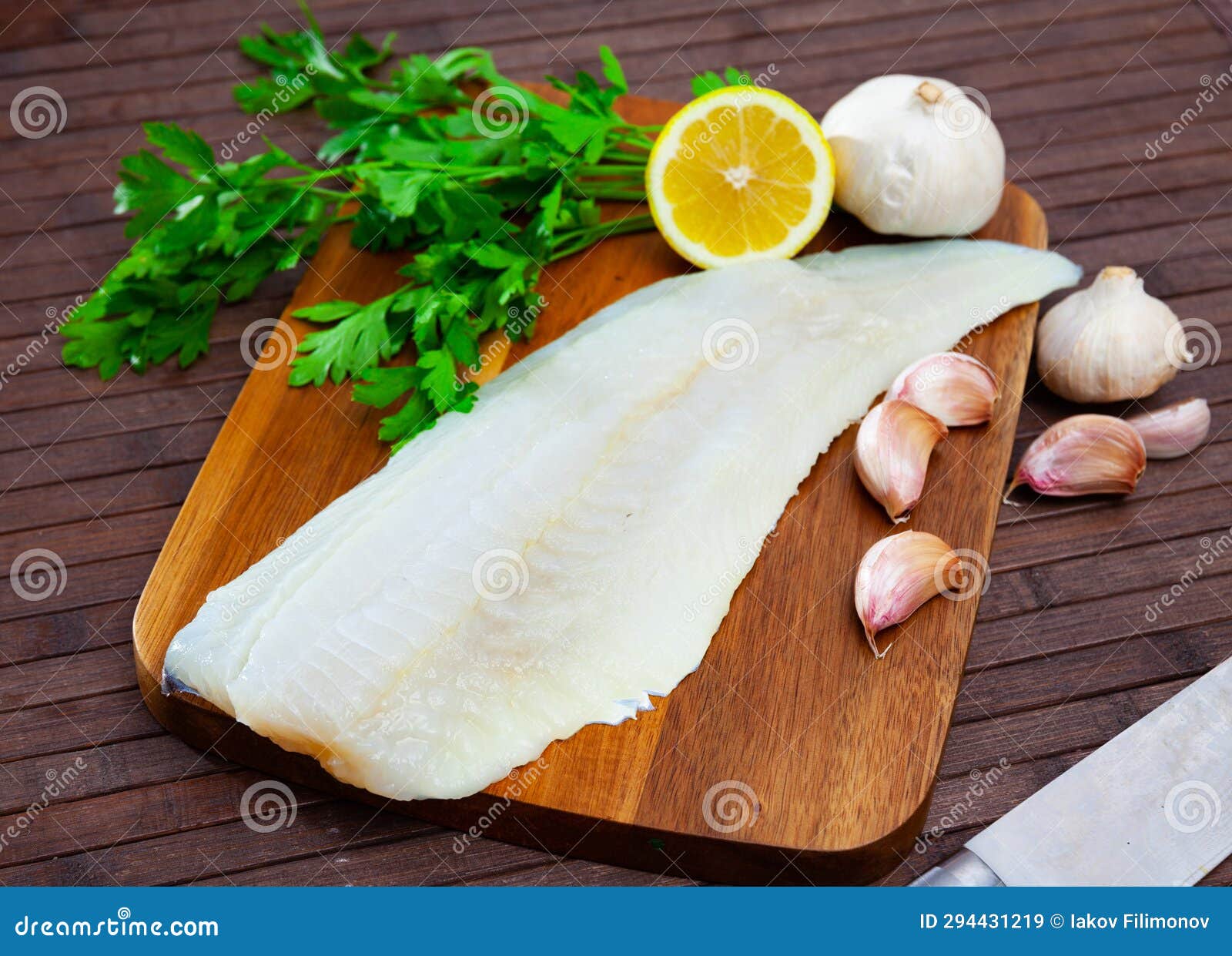 Fresh Cod Fillet with Parsley on Wooden Board Stock Image - Image of ...