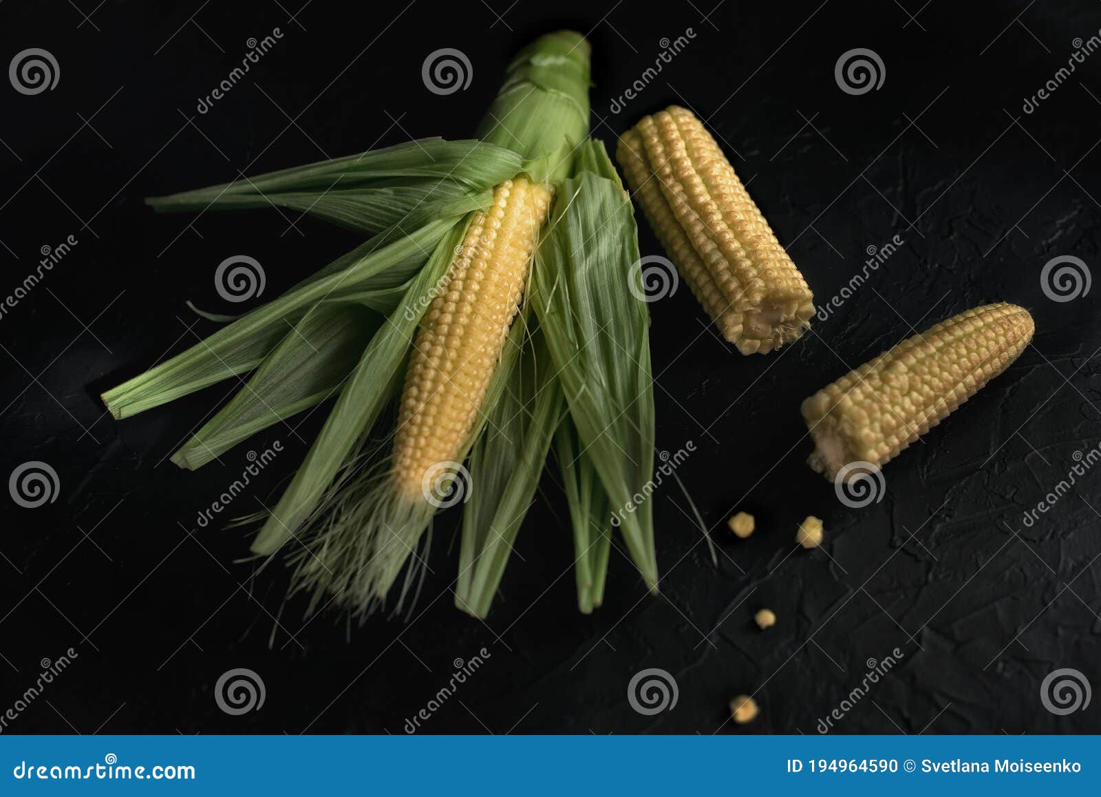 Fresh Corn on the Cob with Seeds on a Concrete Background Close Up ...