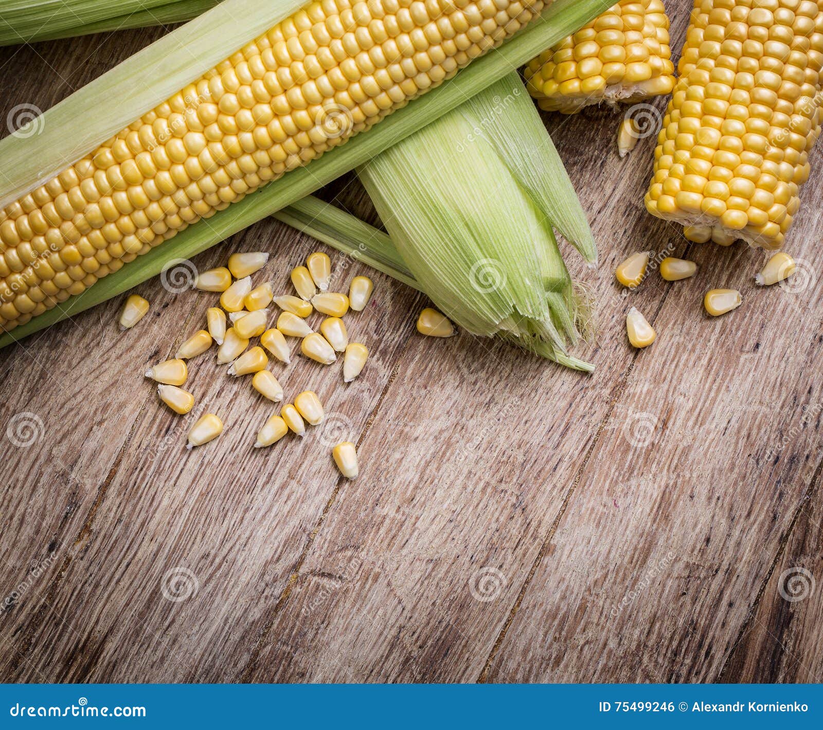 Fresh corn on wooden table stock photo. Image of leaf - 75499246