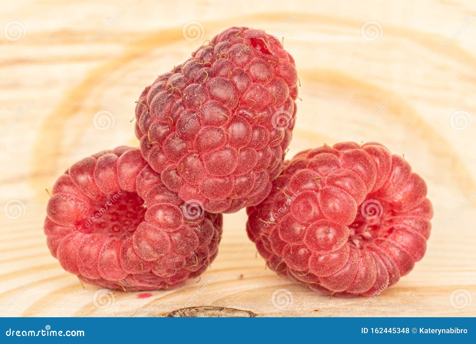 Fresh Crimson Raspberry on Wood Stock Photo - Image of closeup, light ...