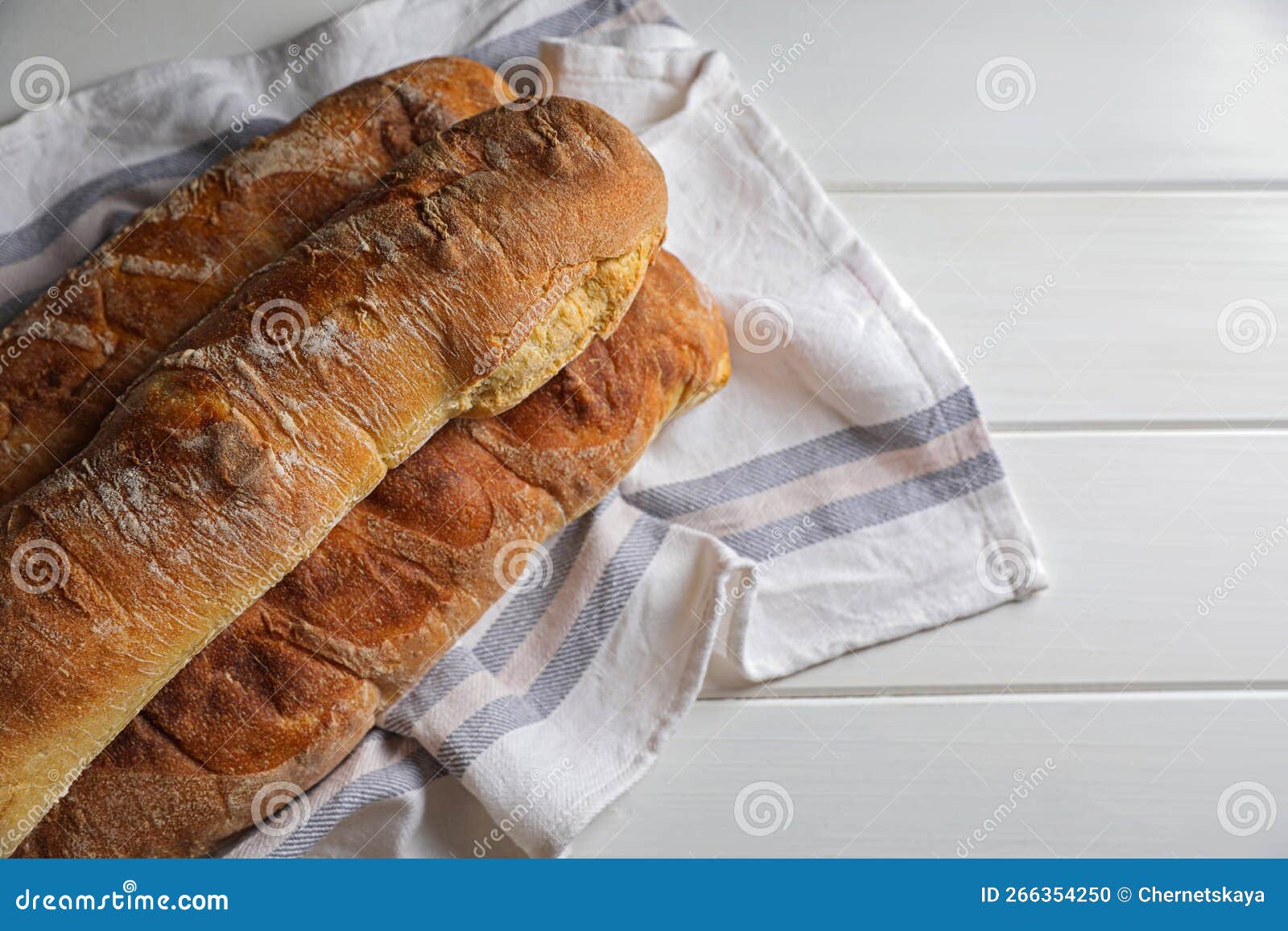 Fresh Crispy Ciabattas on White Wooden Table, Top View. Space for Text ...