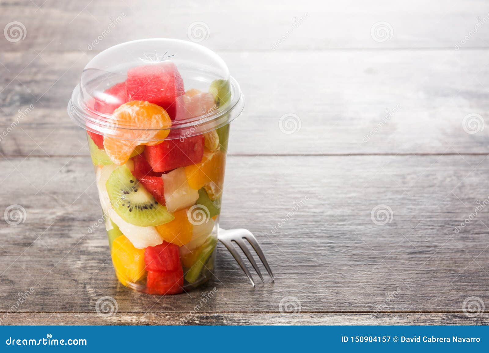 Fresh Cut Fruit in a Plastic Cup on Wood Stock Image - Image of fresh ...