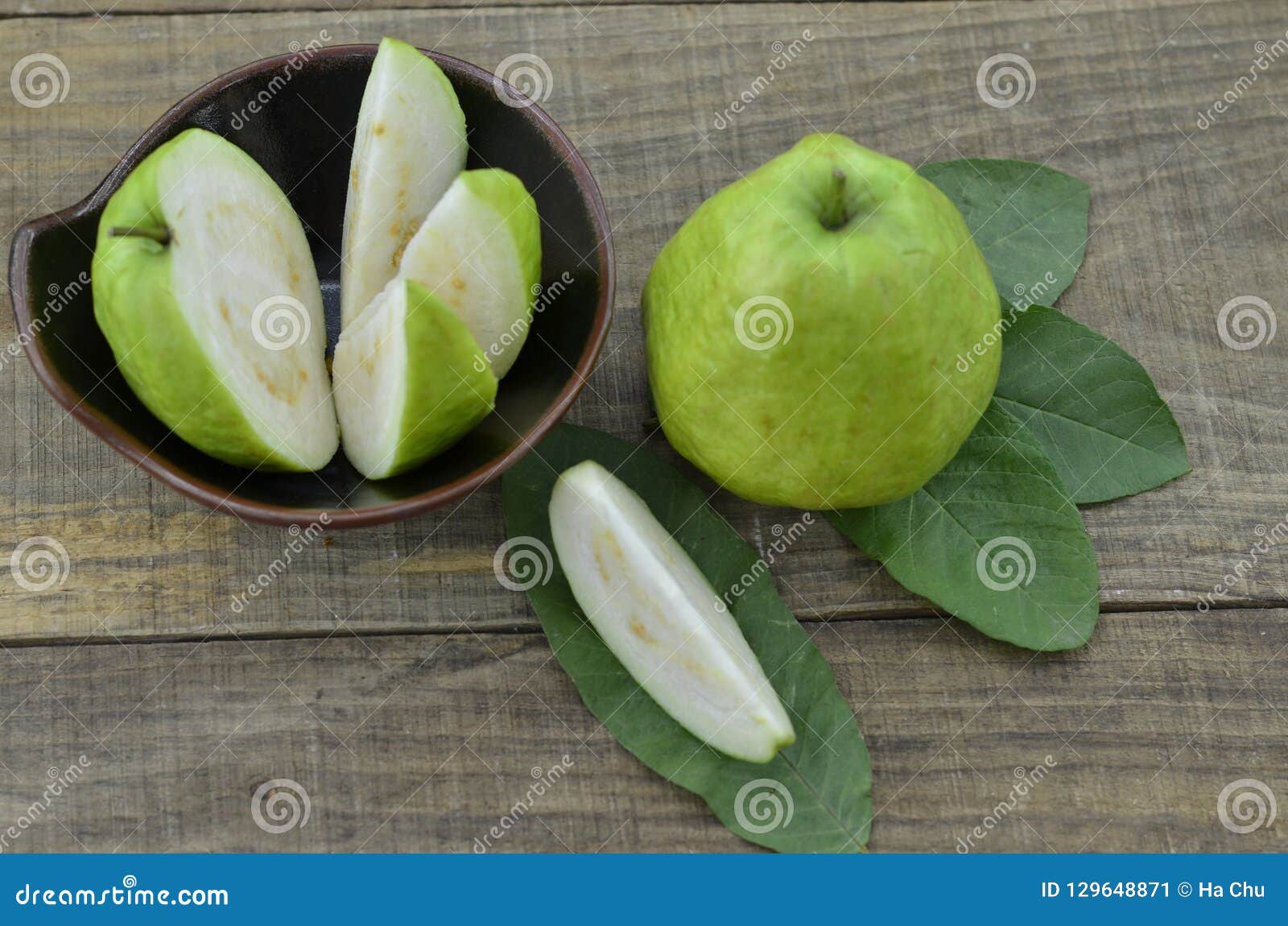 Fresh Cut Guava in Bowl on Wooden Table Stock Image - Image of ...