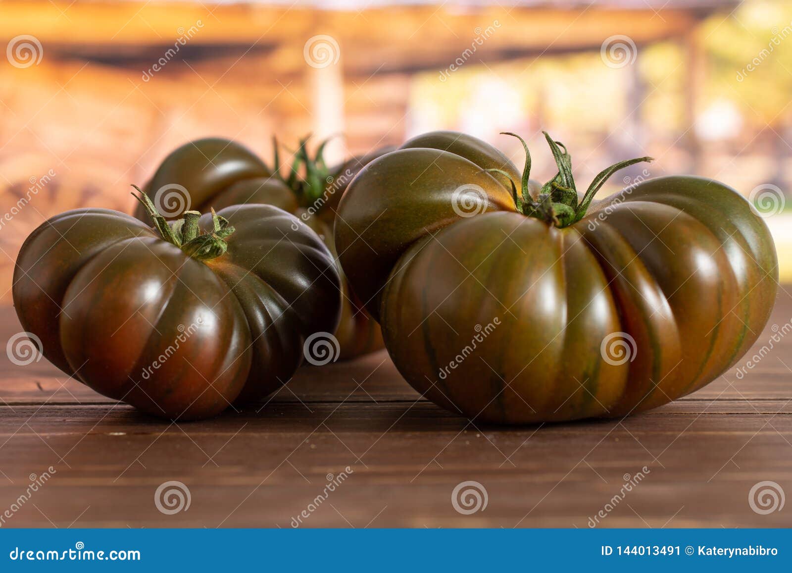 Fresh Dark Tomato Primora with Cart Stock Image - Image of glossy ...
