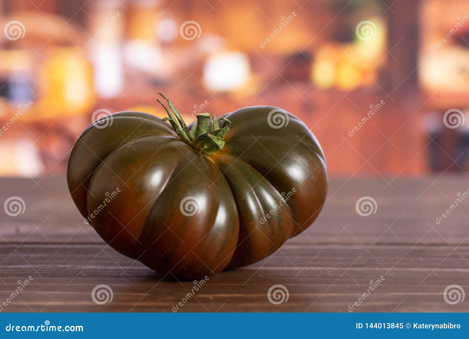 Fresh Dark Tomato Primora with Rustic Kitchen Stock Image - Image of ...