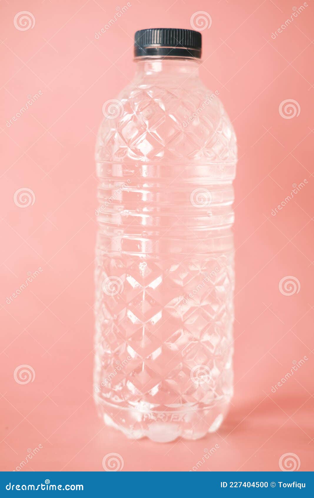 Fresh Drinking Water in a Plastic Bottle on Pink Stock Photo - Image of ...