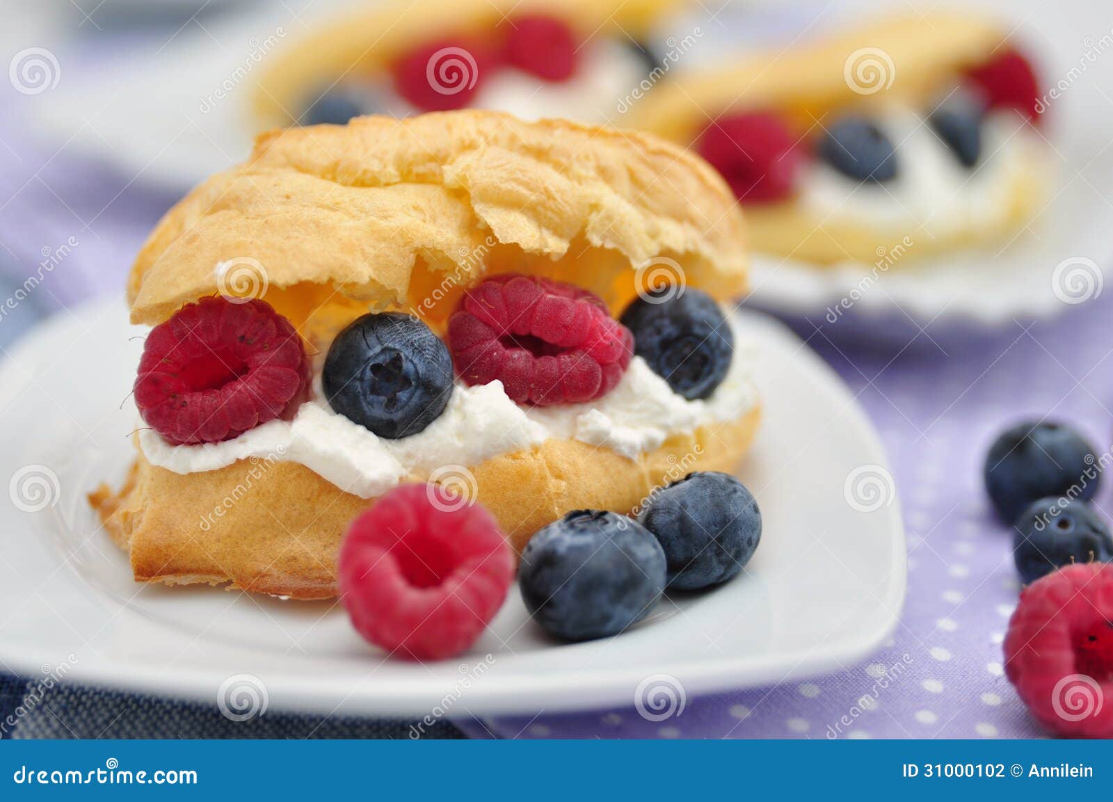 Fresh Eclairs with Whipped Cream and Berries Stock Photo - Image of ...