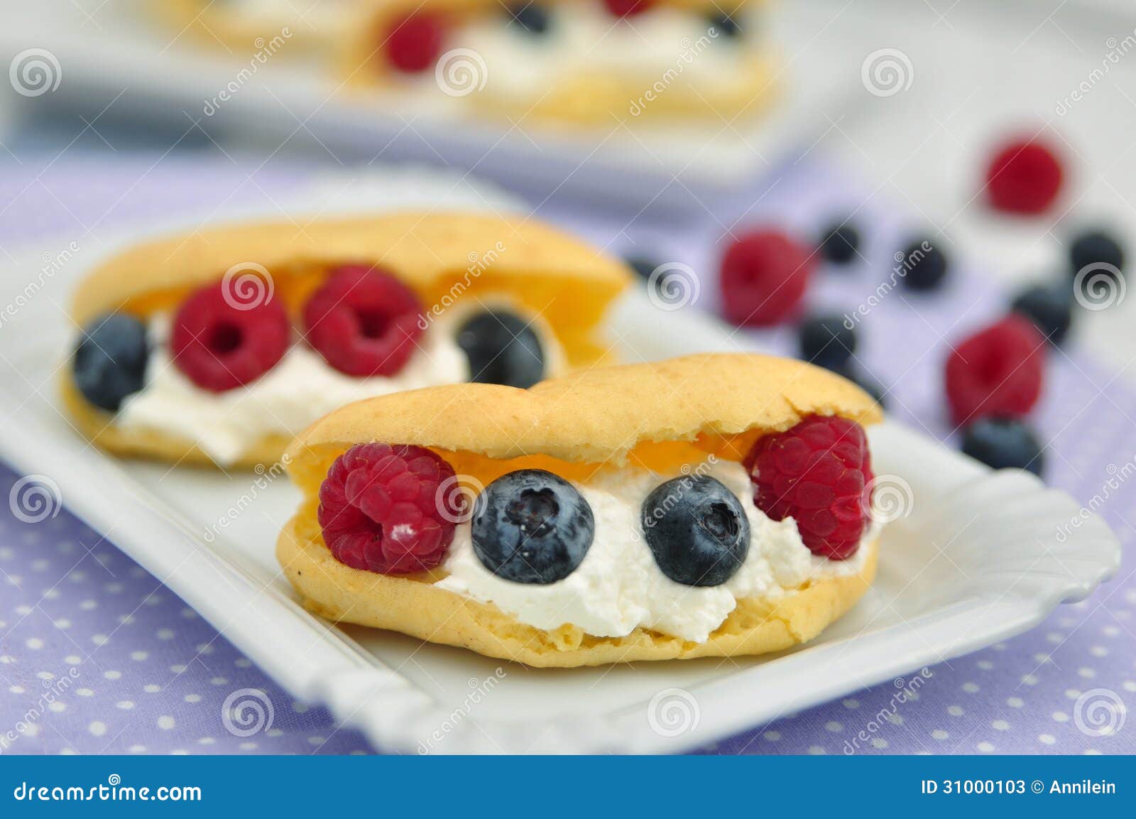 Fresh Eclairs with Whipped Cream and Berries Stock Image - Image of ...