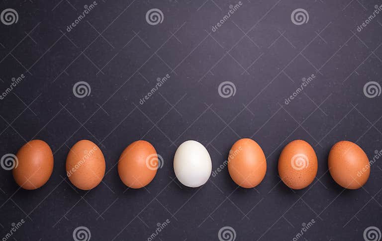 Fresh Egg and Boiled Egg without Shell. Top View on Black Stone Stock ...