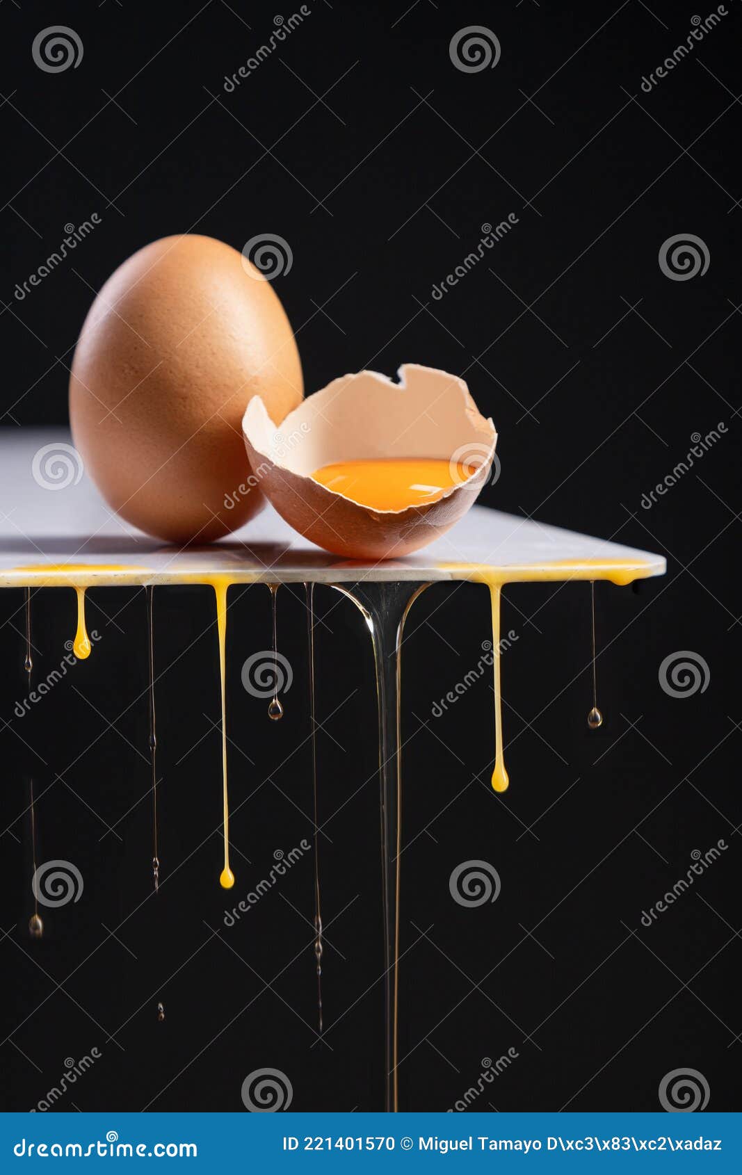 Fresh Egg Spilling Out on Black Background Stock Photo - Image of ...