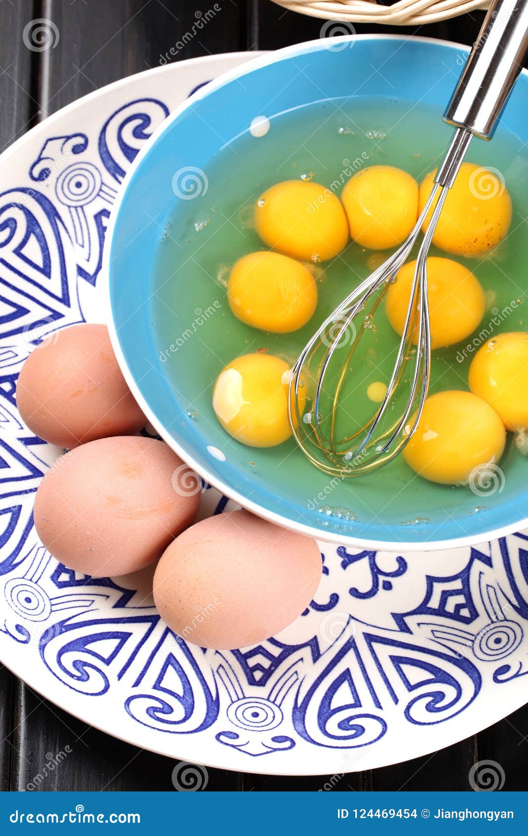 Fresh egg whites and yolks stock photo. Image of checked - 124469454