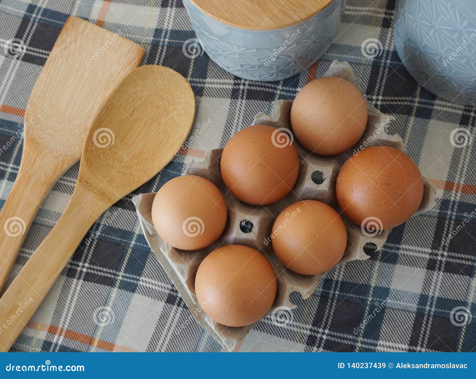 Fresh Eggs on the Kitchen Table in Paper Egg Box, with Accessories for ...