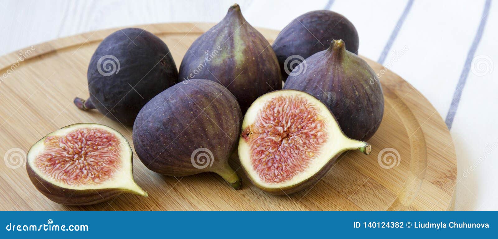 Fresh Figs on Round Bamboo Board, Side View. Close-up Stock Photo ...