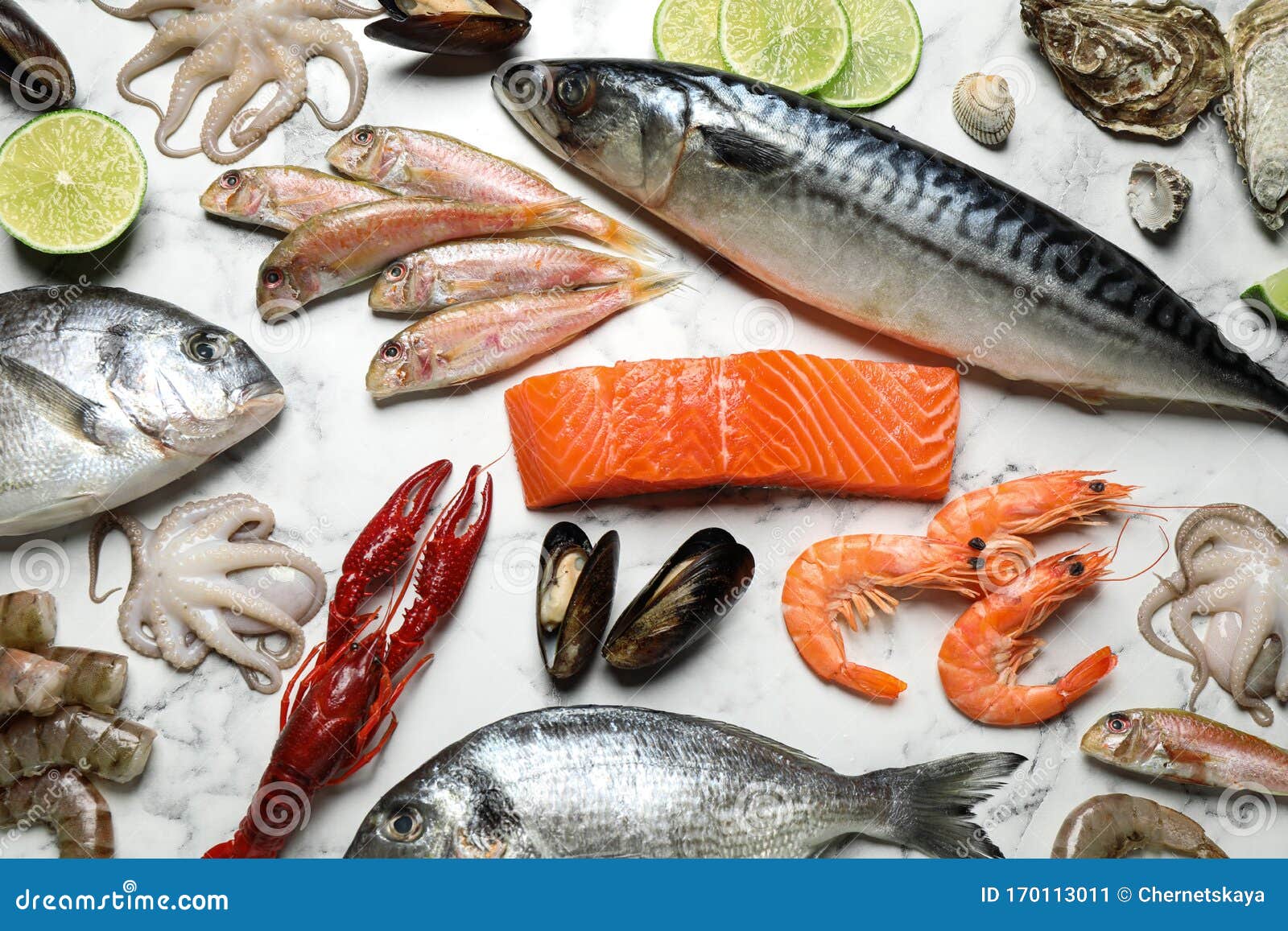 Fresh Fish and Different Seafood on White Marble Table Stock Image ...