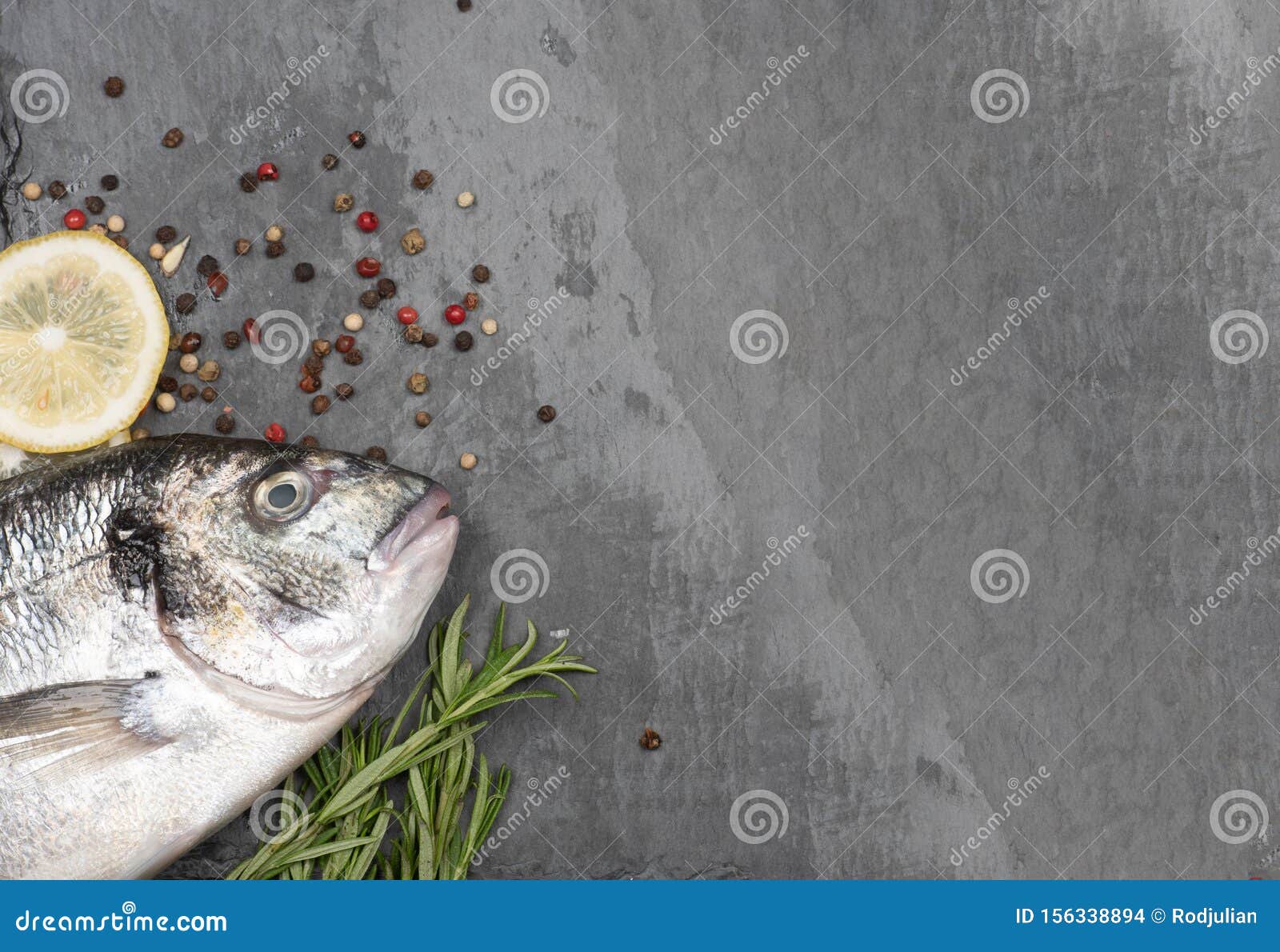 Fresh Fish Dorado. Dorado and Ingredients for Cooking on a Table. Stock ...
