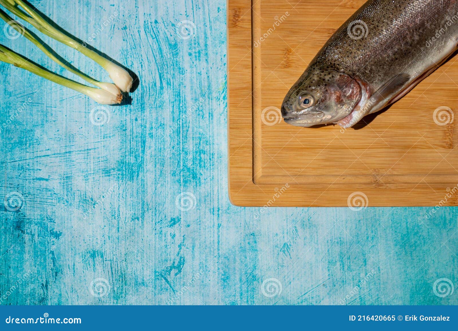 Fresh Fish on Kitchen Board with Blue Background Stock Image - Image of ...