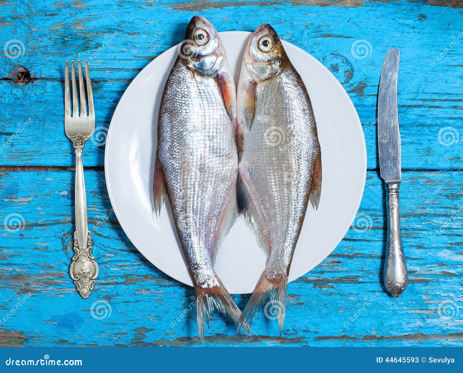 Fresh Fish on the Plate, Table Setting, Wooden Background Stock Image ...