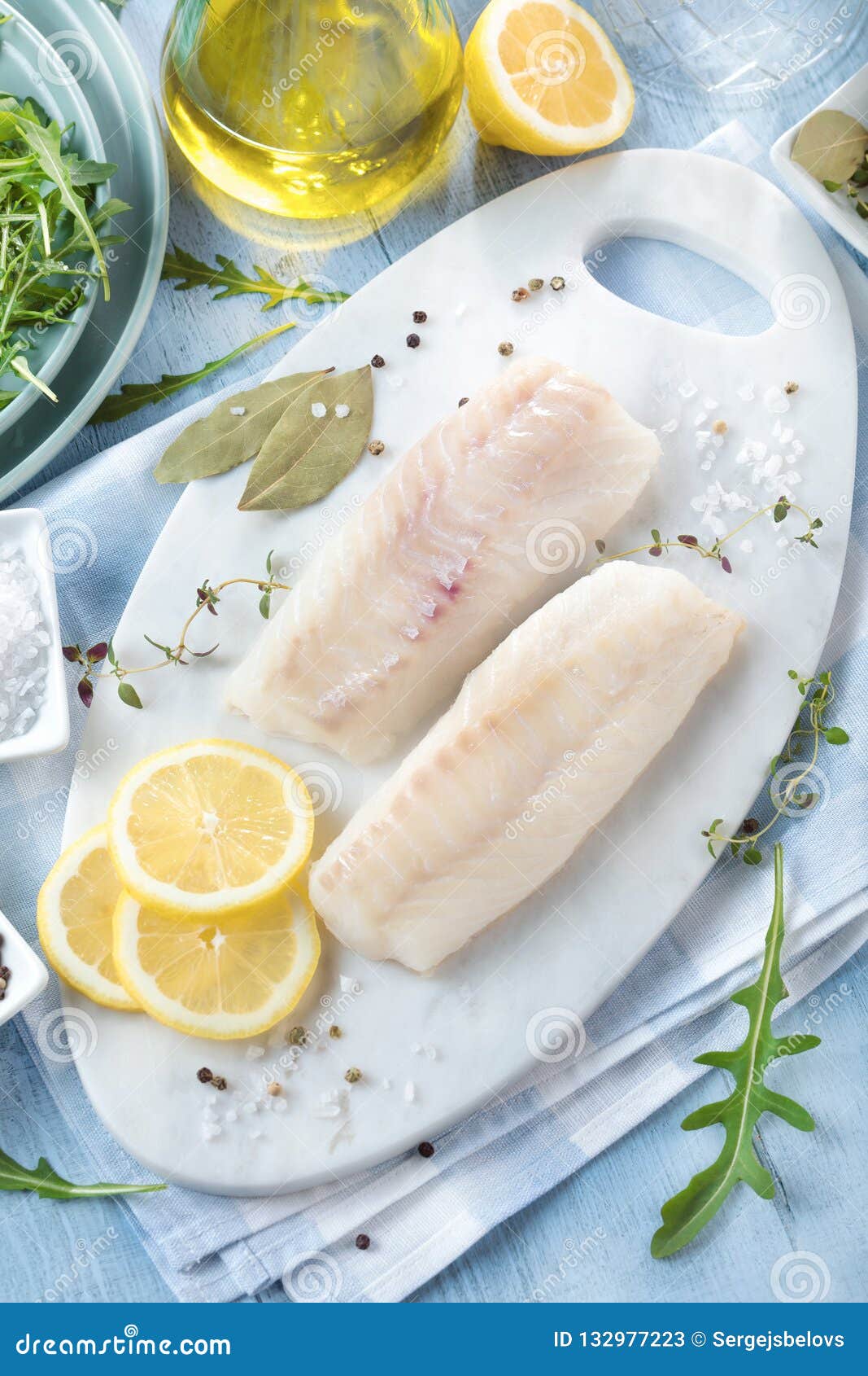 Fresh Fish, Raw Cod Fillets with Addition of Herbs and Lemon. Stock ...