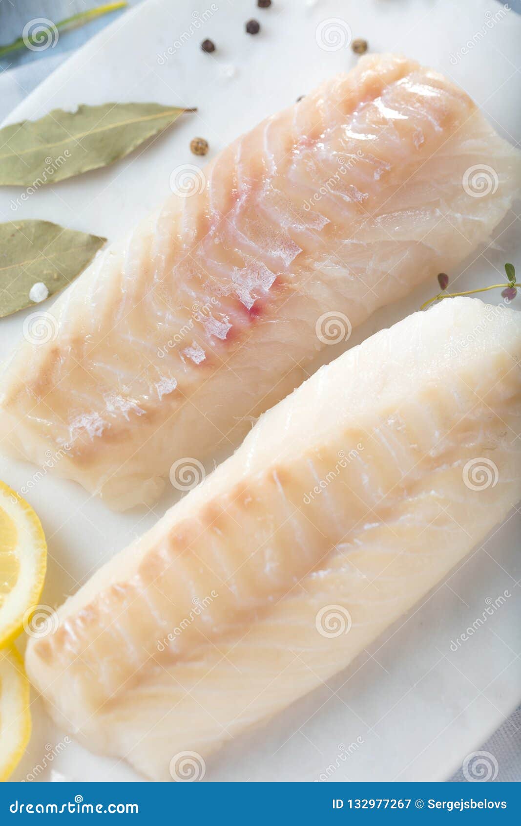 Fresh Fish, Raw Cod Fillets with Addition of Herbs and Lemon. Stock ...