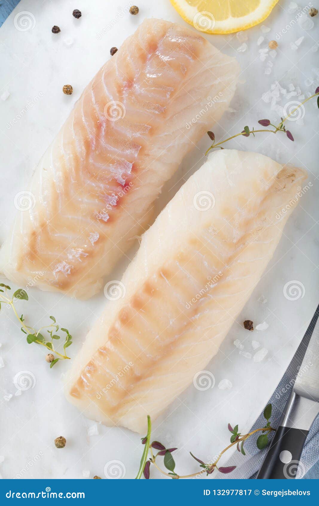 Fresh Fish, Raw Cod Fillets with Addition of Herbs and Lemon. Stock ...