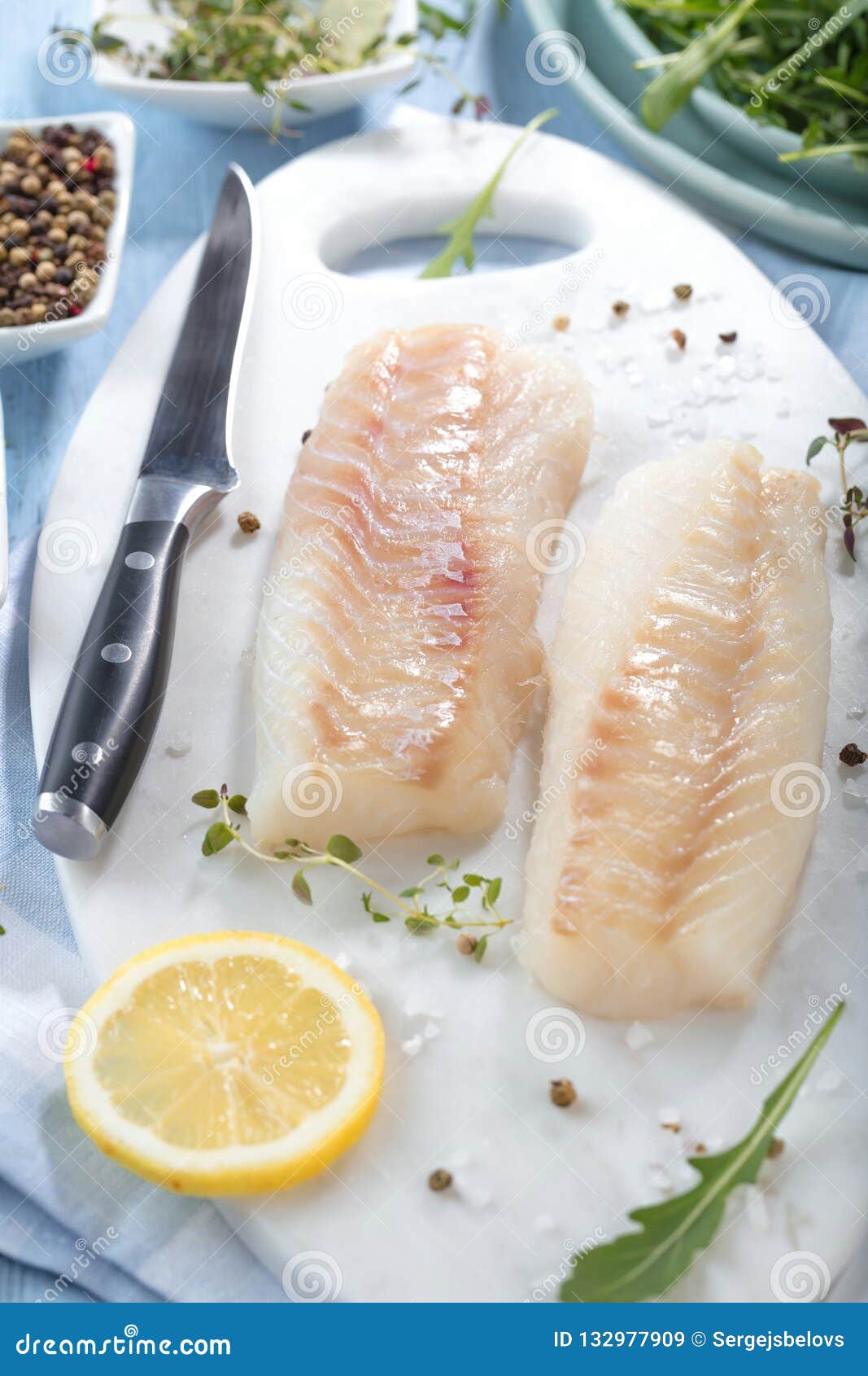 Fresh Fish, Raw Cod Fillets with Addition of Herbs and Lemon. Stock ...