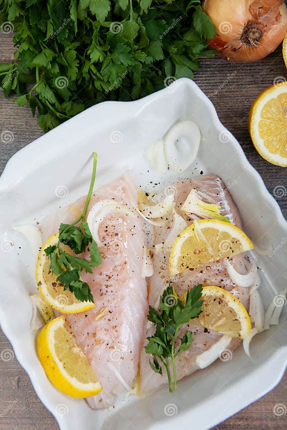 Fresh Fish, Raw Cod Fillets with Addition of Herbs and Lemon Stock ...