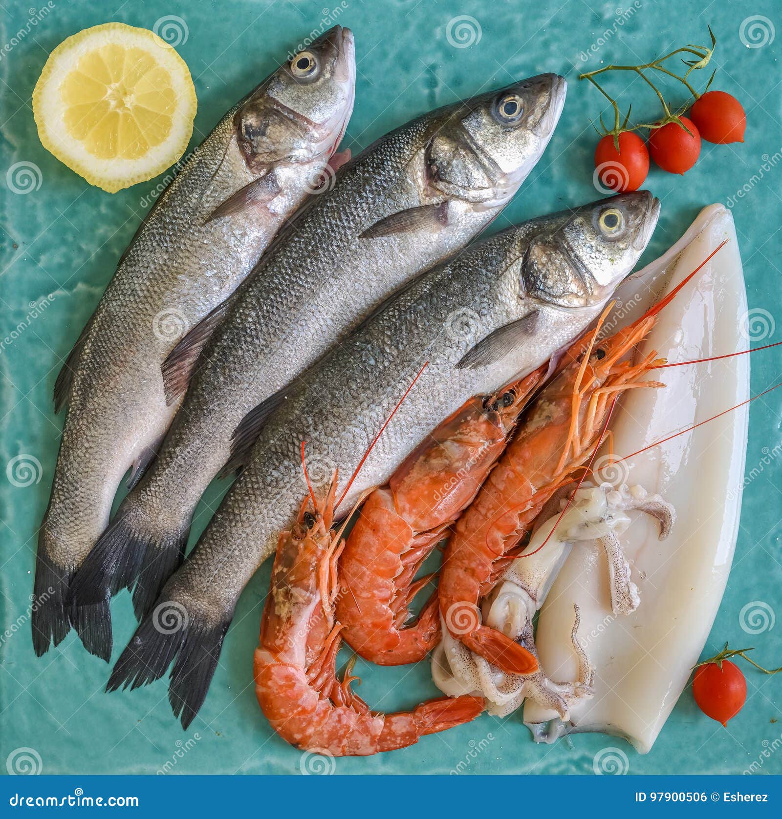 Fresh Fish, Shrimp and Squid on a Blue Marble Surface Stock Photo ...