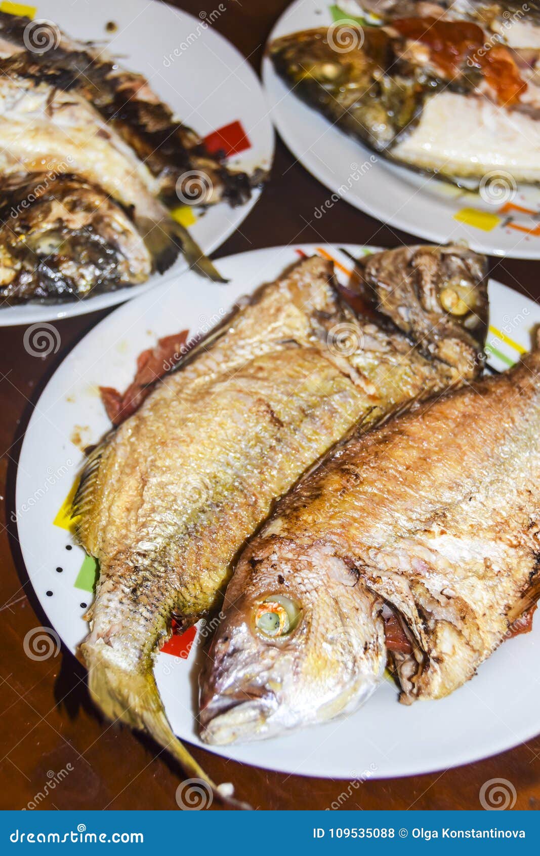 Fresh Fried Baked Fish with Scales and Lemon in a Plate Stock Photo ...