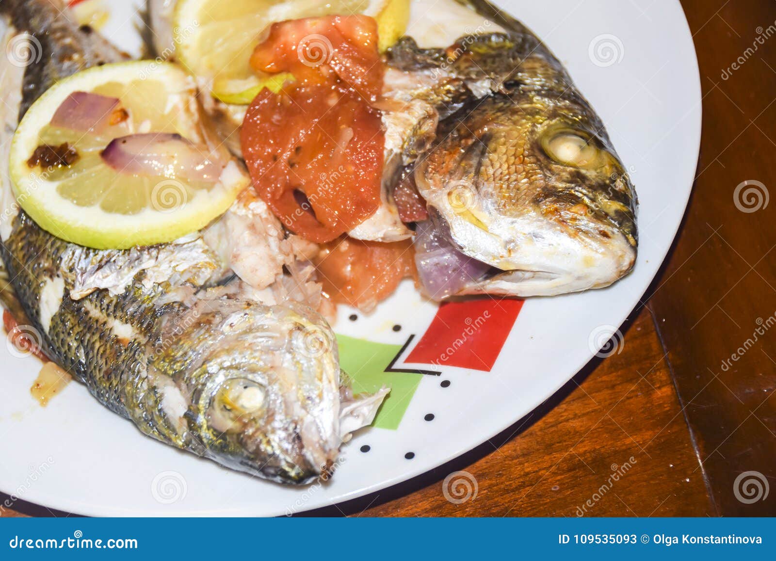 Fresh Fried Baked Fish with Scales and Lemon in a Plate Stock Image ...