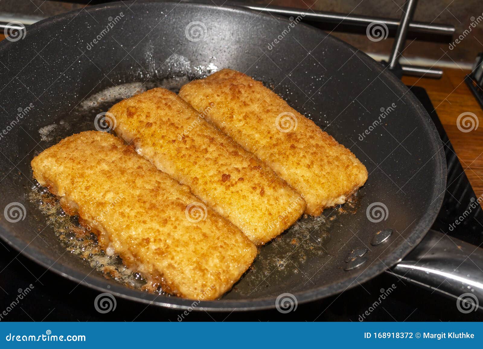 Fresh Fried Crispy Fish Fillets with Breading in a Pan Stock Photo ...