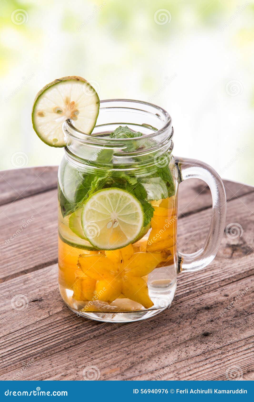 Fresh Fruit Flavored Infused Water Mix of Starfruit, Mint and Li Stock ...