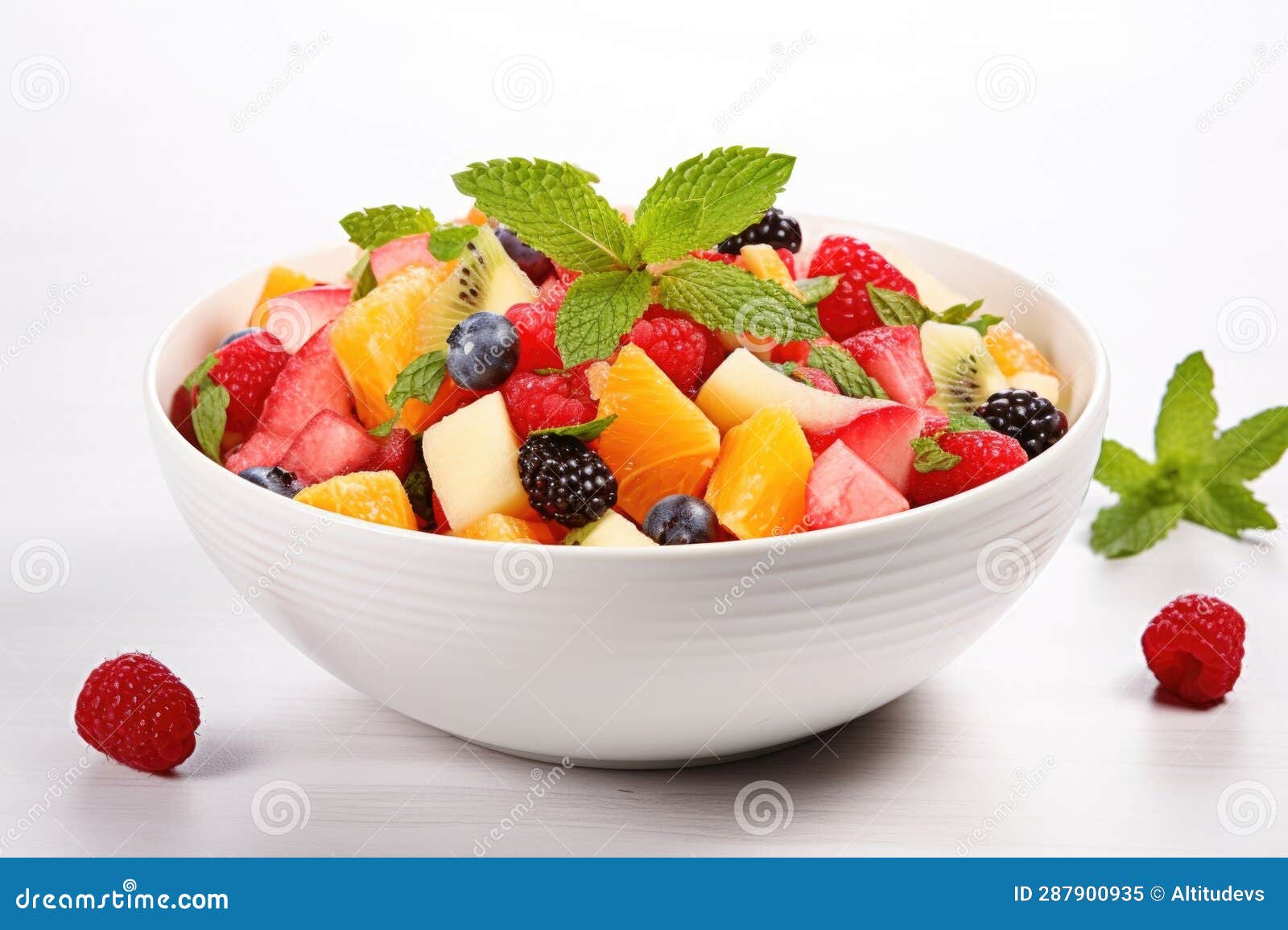 Fresh Fruit Salad with Mint Leaves on a White Background Stock ...