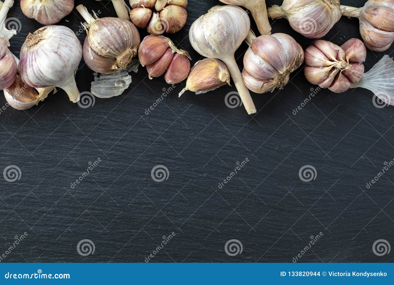 Fresh Garlic on a Black Stone Surface, Top View, Copy Space Stock Photo ...