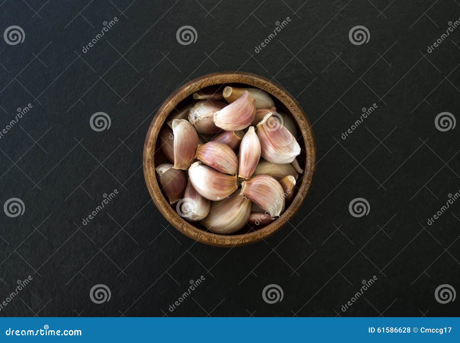 Fresh garlic in a bowl stock photo. Image of freshness - 61586628