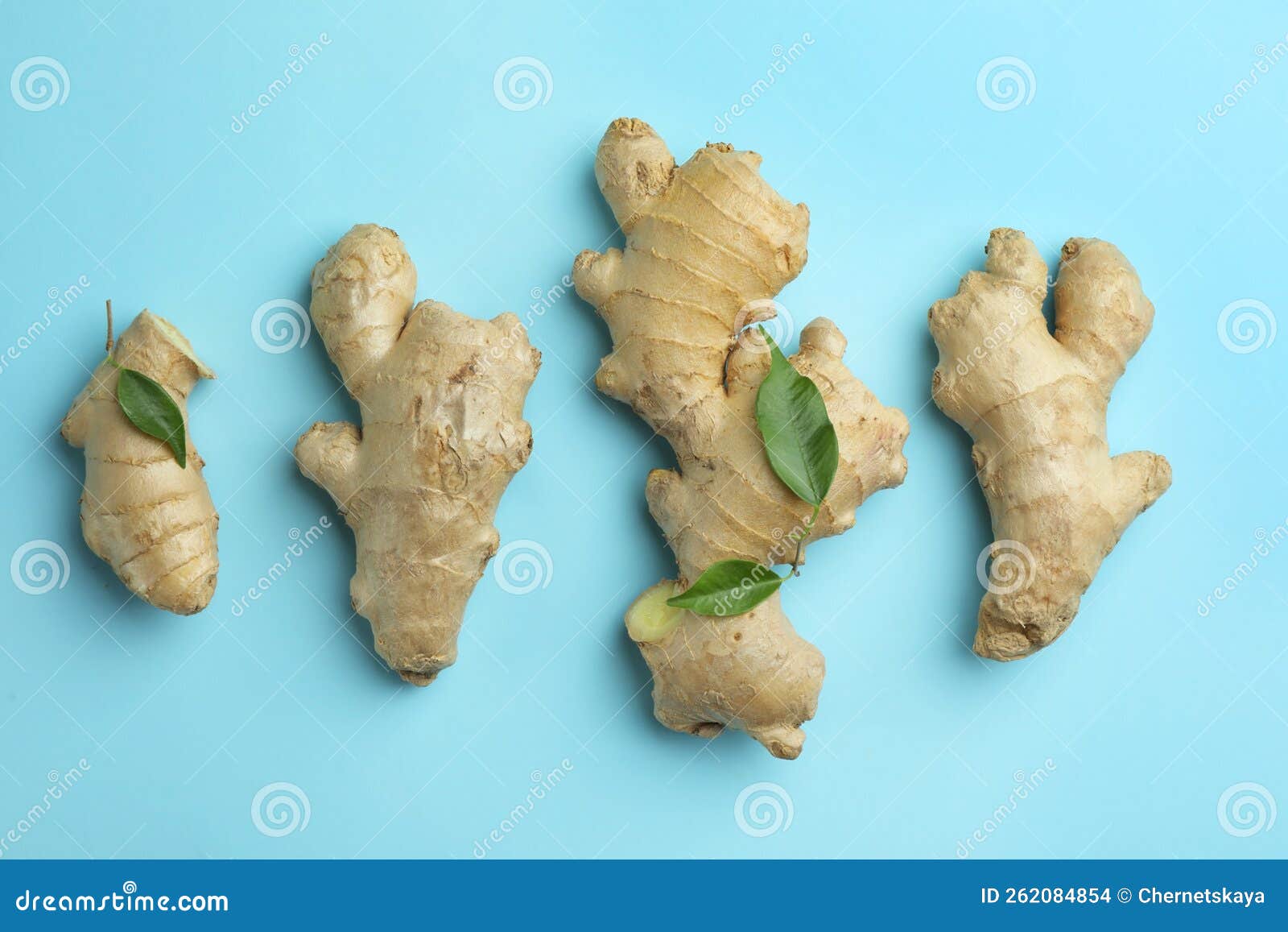 Fresh Ginger with Green Leaves on Pale Light Blue Background, Flat Lay ...